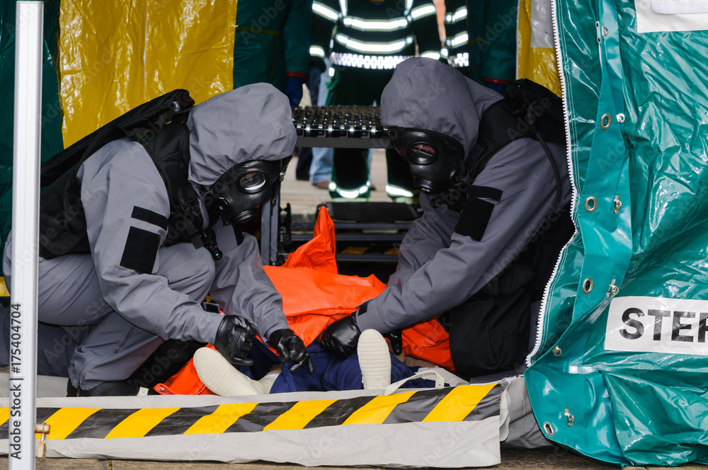 Paramedics demonstrate the decontamination procedure during the launch ...