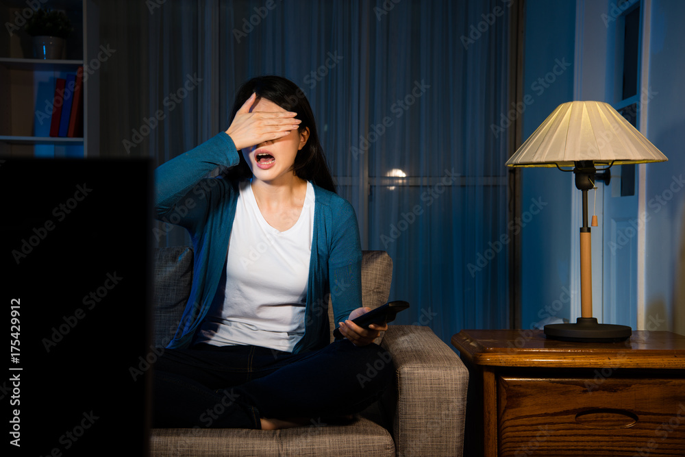 young girl watching movie looking at terrible plot Stock Photo | Adobe ...