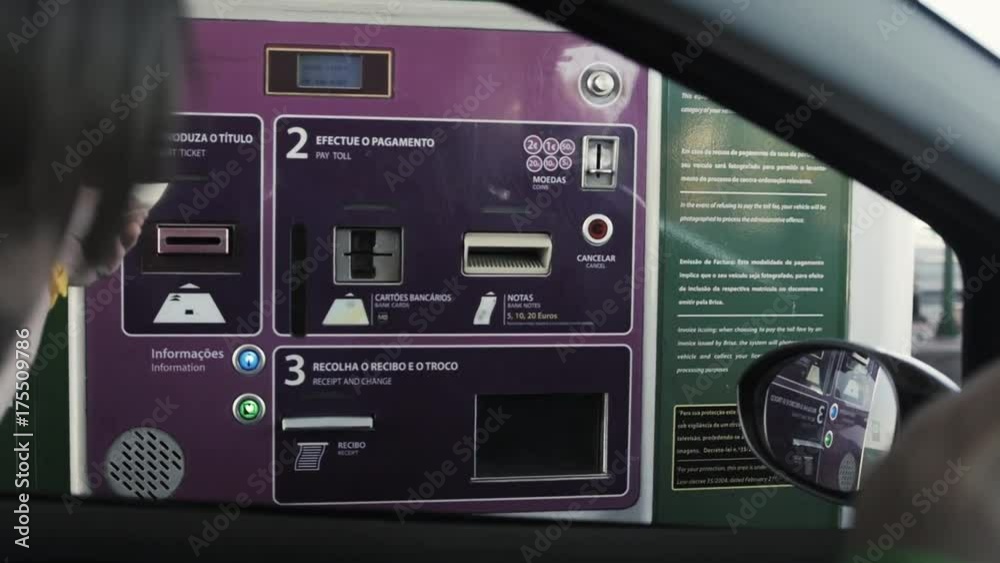 A man pays money by card in terminal to a cashier for a toll road Toll ...