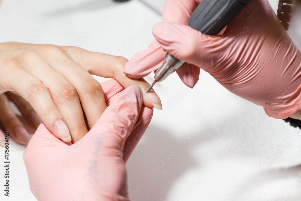 Hardware manicure. Removal of old gel varnish in the salon. Manicure ...