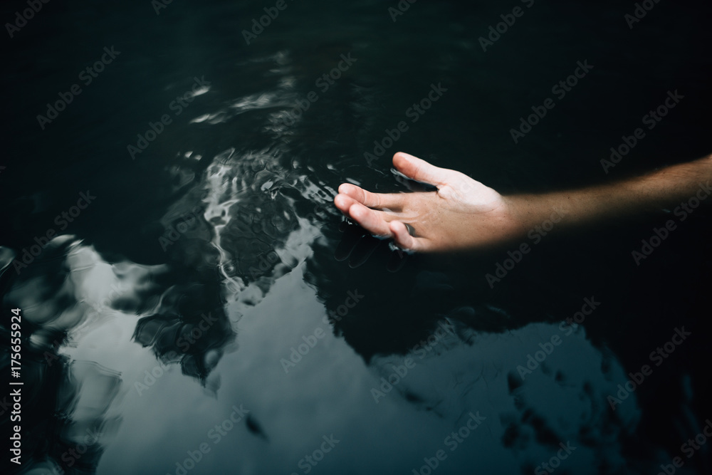 Hand in body of water Stock Photo | Adobe Stock