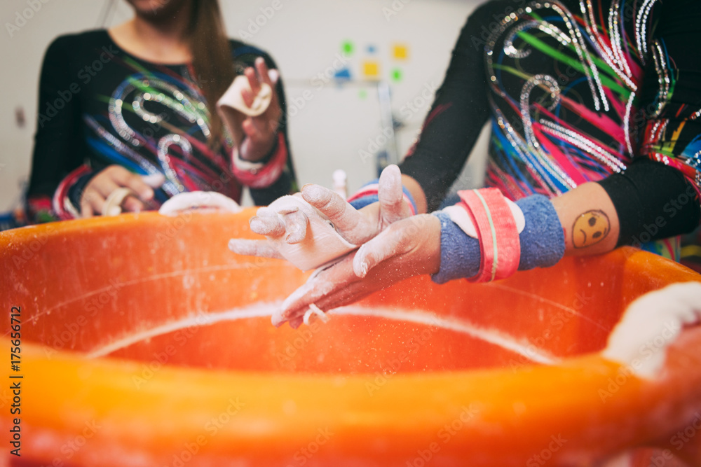 Gymnastics: Girls Getting Chalk On Hands Before Practicing Bars Stock ...