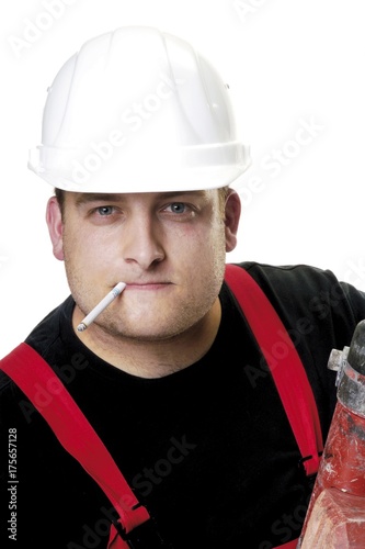 Construction worker wearing a white hardhat smoking a cigarette Stock ...