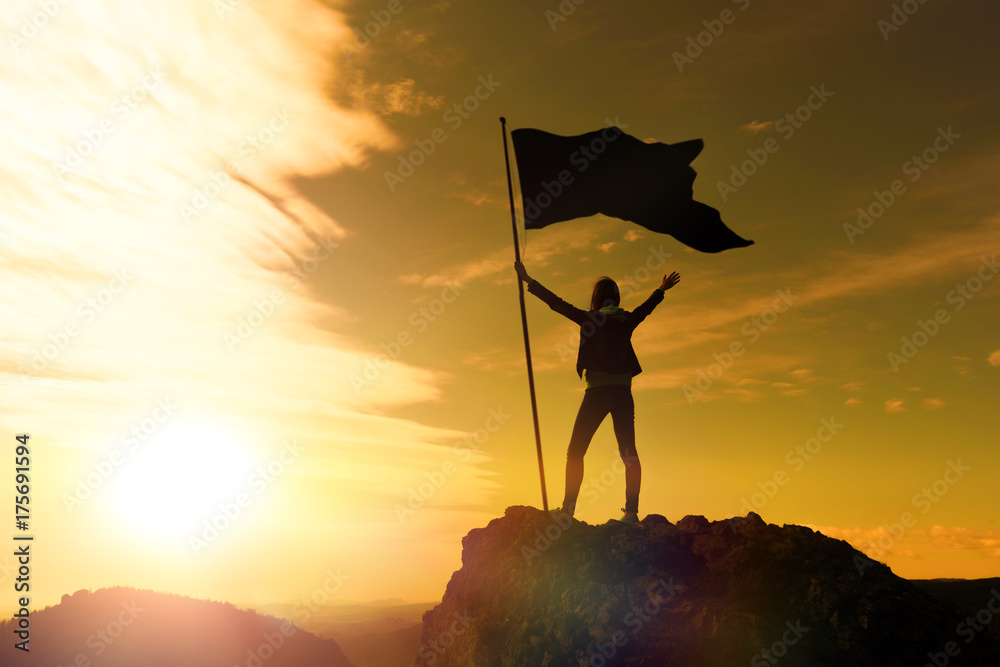 High achievement, silhouettes of the girl, flag of victory on the top ...