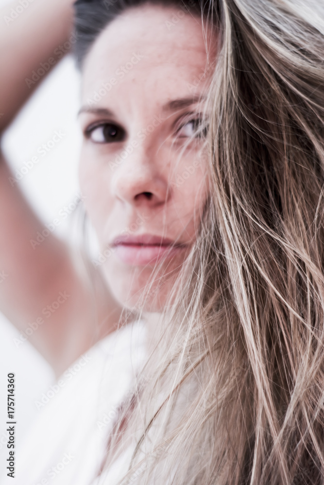 Portrait of the face of a beautiful blond woman on white background ...