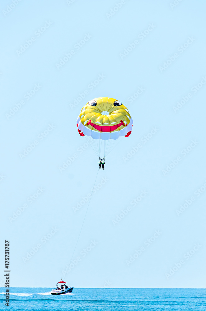 ALBENA, BULGARIA - JUNE 15, 2017: Colored parasail wing pulled by a ...