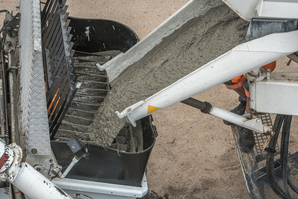 construction site pouring concrete. Concrete pouring into a concrete ...