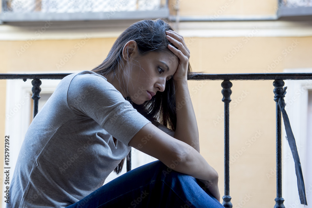 desperate sad Latin woman at home balcony looking devastated and ...