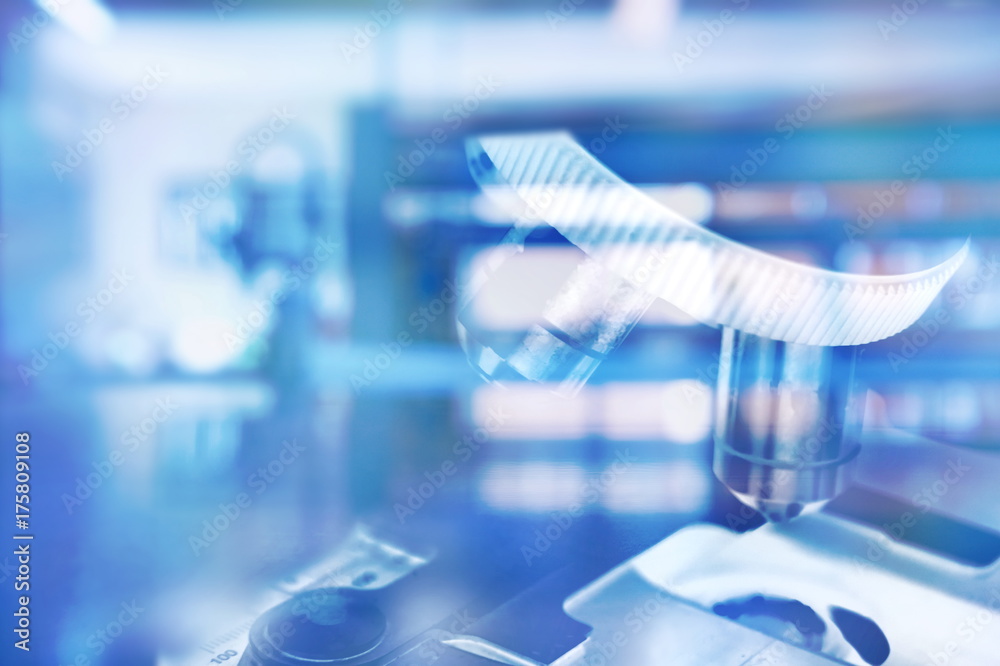 microscope in blue science medical technology laboratory background ...