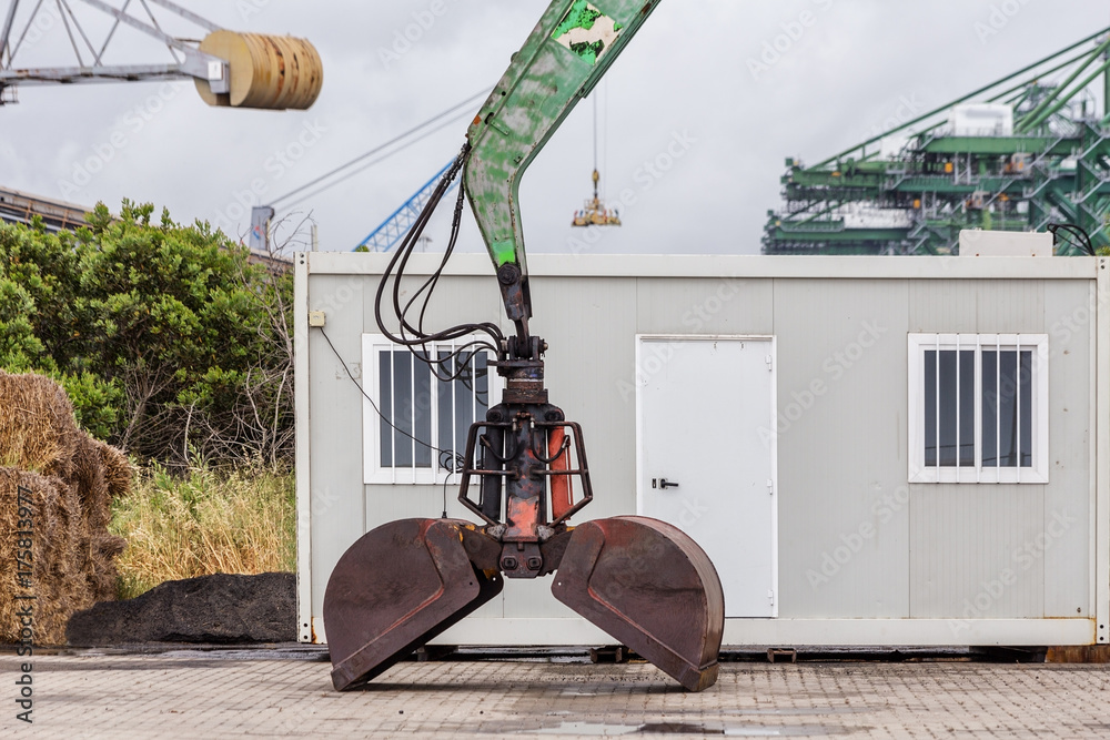 Bucket excavator in old seaport for loading sand. Stock Photo | Adobe Stock