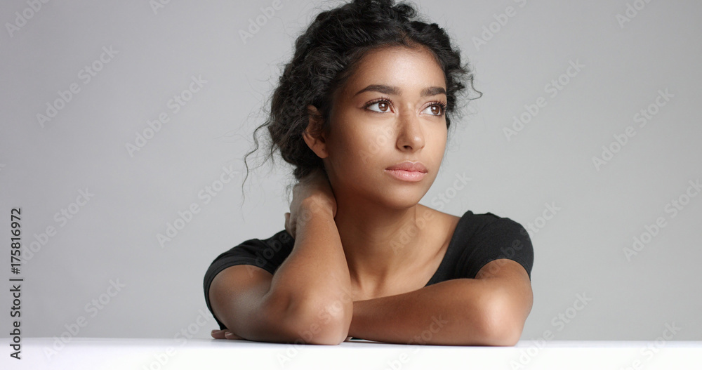 Attractive young Middle Eastern model touching her pretty face with ...