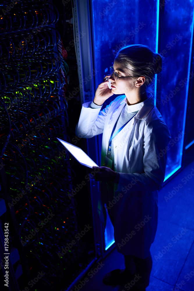 High angle portrait of beautiful female scientist working with ...