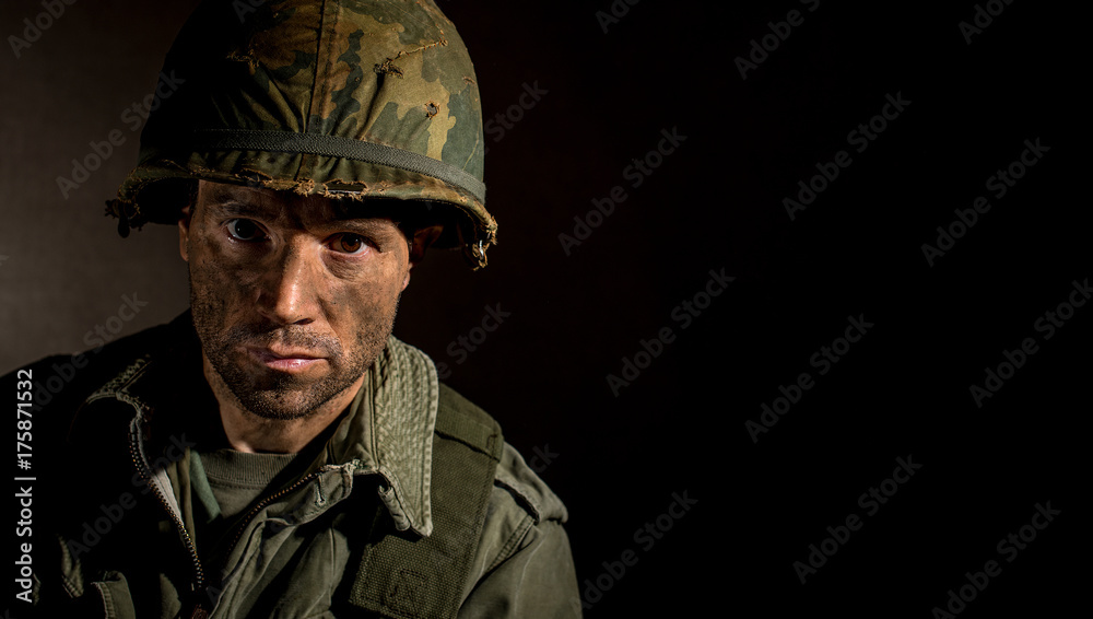 Portrait of combat stressed US Marine (Vietnam War) with face covered ...