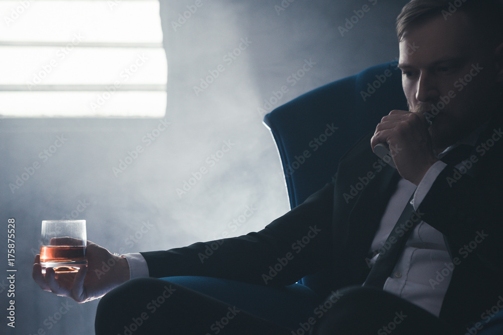 Rich people leisure with alcohol and vape. Modern businessman in ...