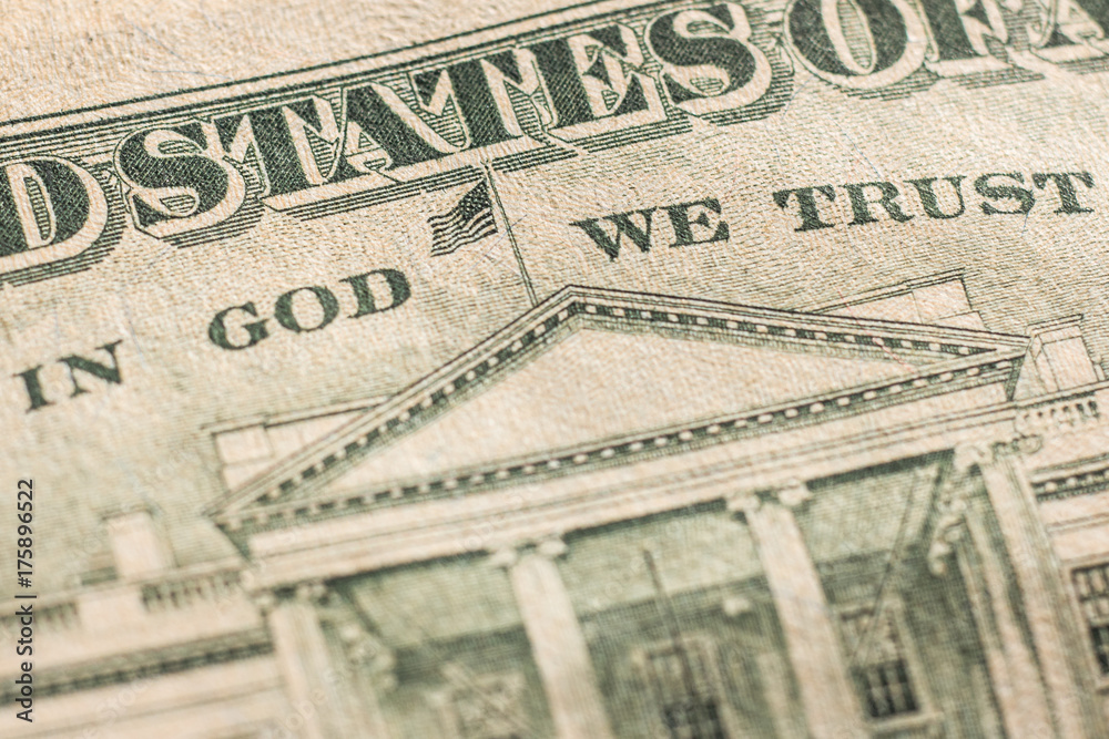 The inscription "In God We Trust" on a twenty dollar bill of the USA ...