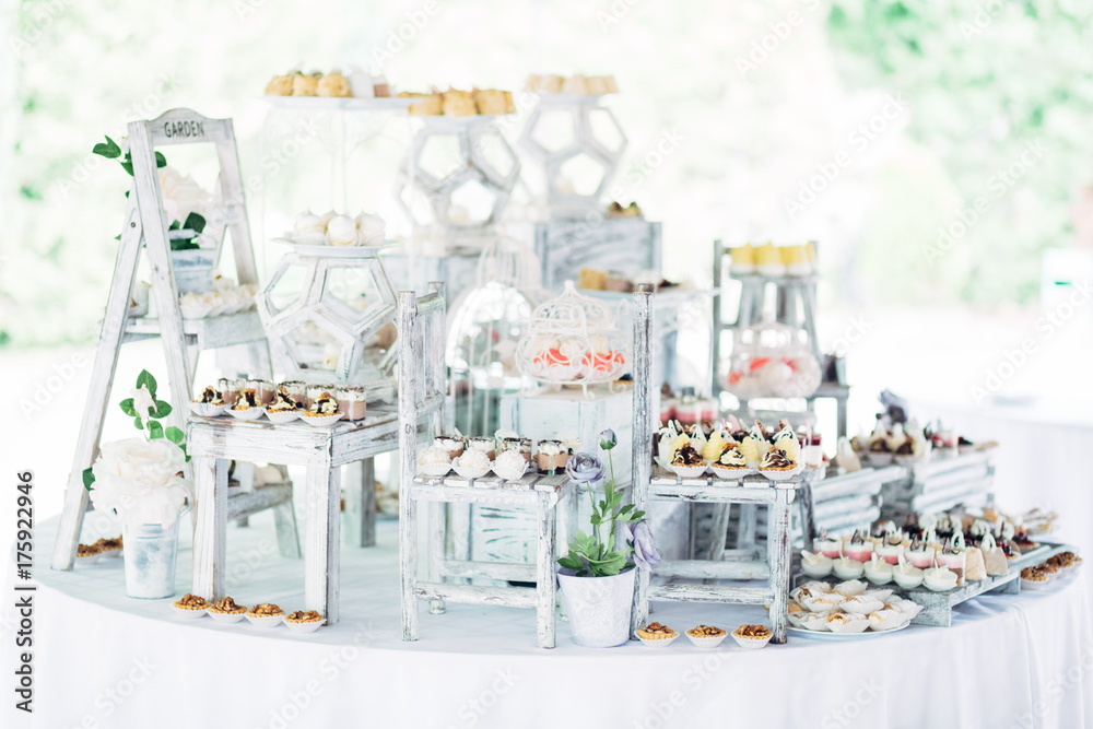 Beautiful candy bar made of little ladders and chairs served with ...