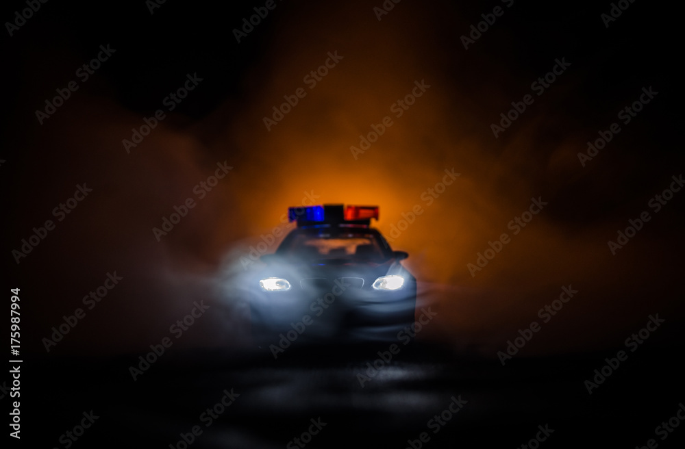 Police car chasing a car at night with fog background. 911 Emergency ...
