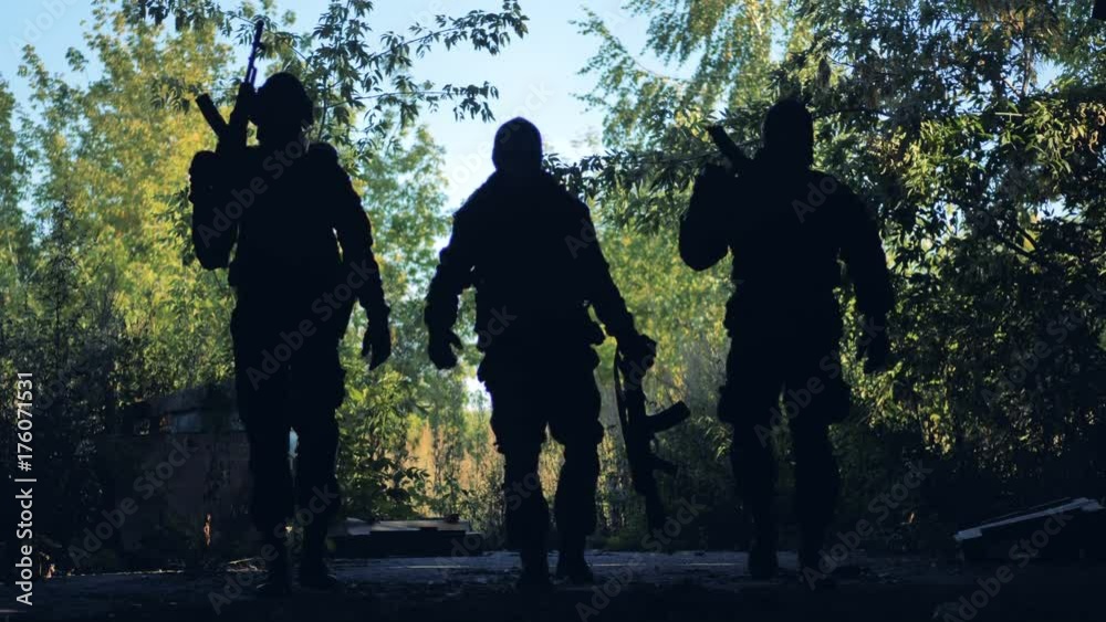 Three dark shapes of armed men walk in to the viewer. Stock 비디오 | Adobe ...
