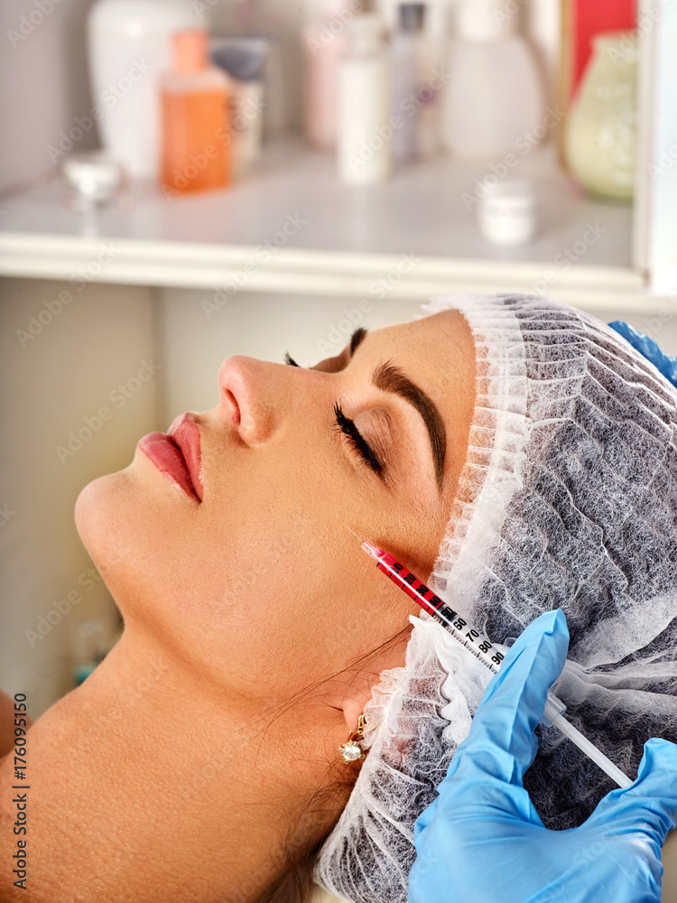 Filler injection for female forehead face. Plastic aesthetic facial ...
