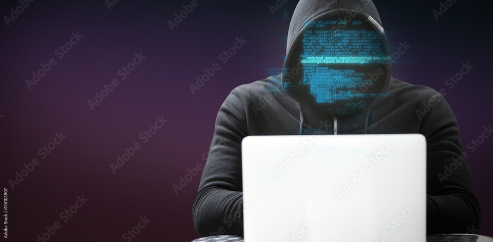 Composite image of hacker wearing black hood while using laptop Stock ...