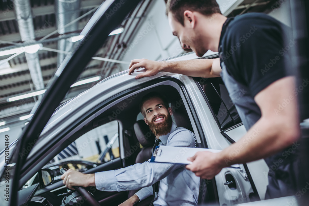 Men in auto service Stock Photo | Adobe Stock
