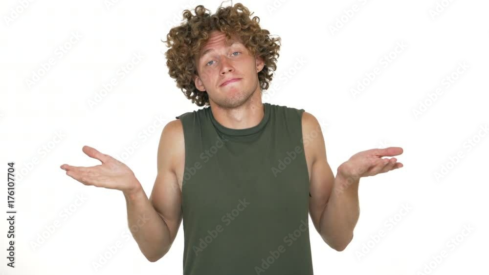 picture of young man checking out mobilephone shrugging with pursed ...