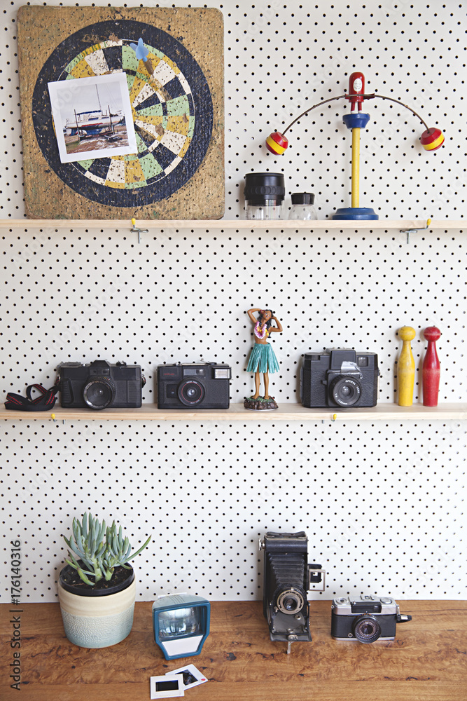 Pegboard / Perforated board with shelves in a studio office Stock Photo ...