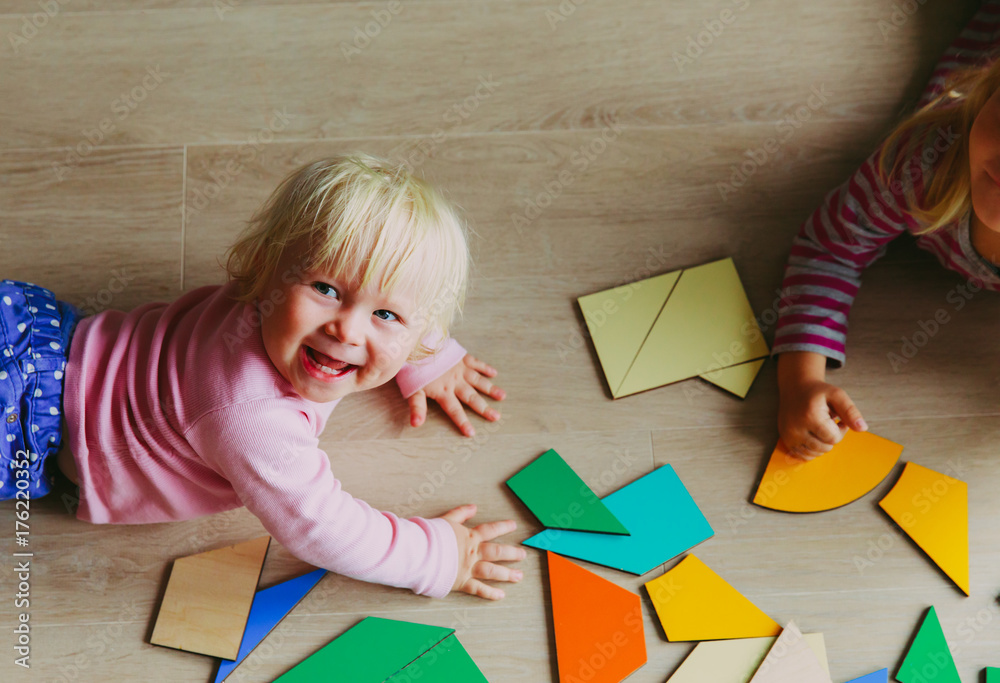 kids playing with puzzle in school or daycare Stock Photo | Adobe Stock