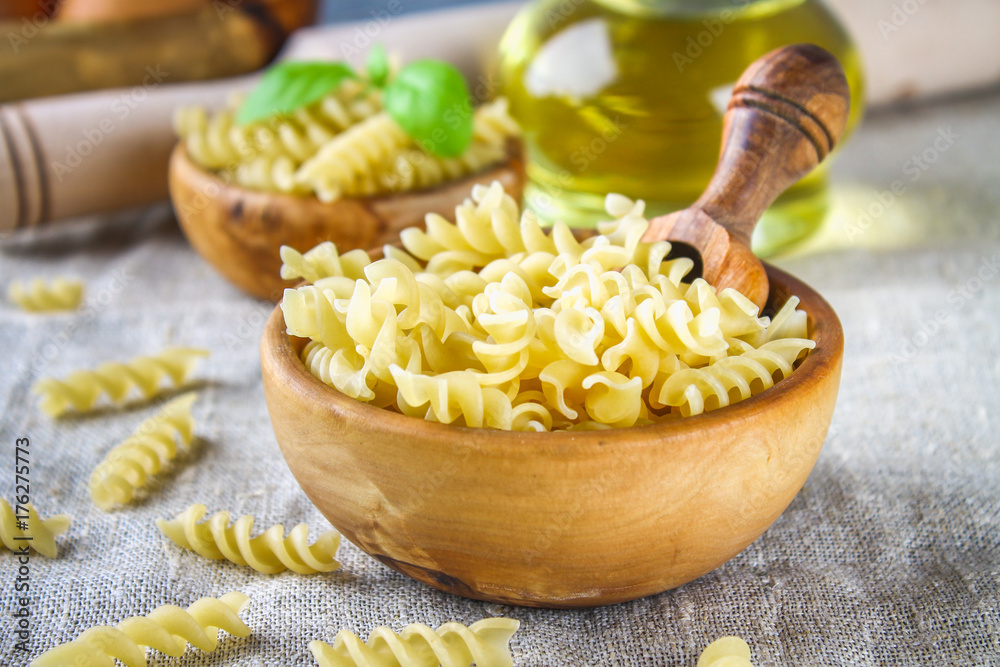 Helix- or corkscrew-shaped pasta. Rotini macaroni. Related to fusilli ...