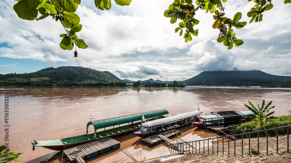 Beautiful morning view of the Mekong river with the boat, the mountain ...