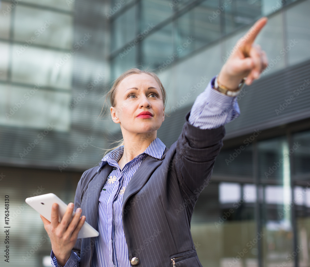 Professional woman pointing finger on object Stock Photo | Adobe Stock