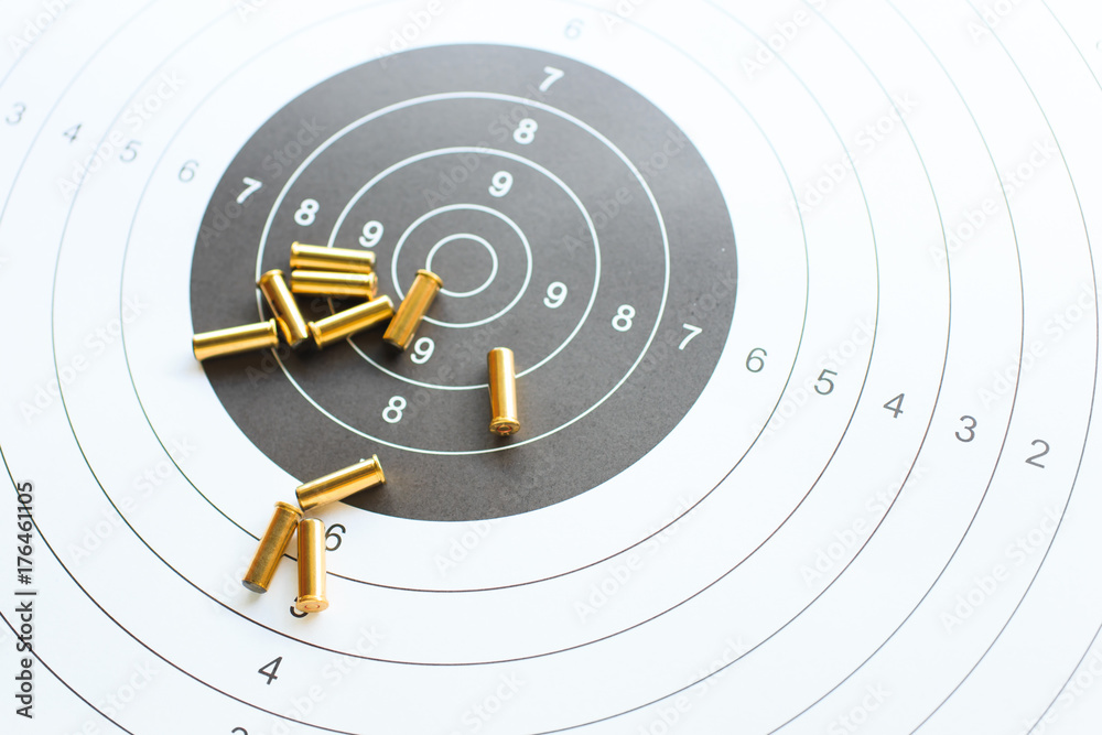 bullets on paper target for shooting practice Stock Photo | Adobe Stock