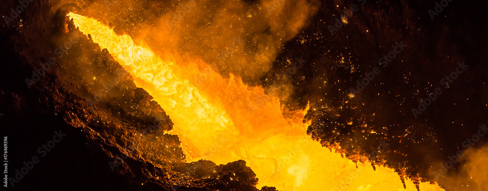 Tapping the Blast Furnace - liquid iron puring out of the taphole of a ...