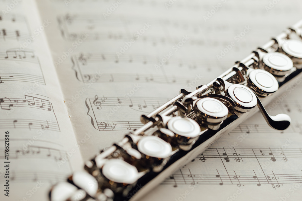 transverse flute on music sheet Stock Photo | Adobe Stock