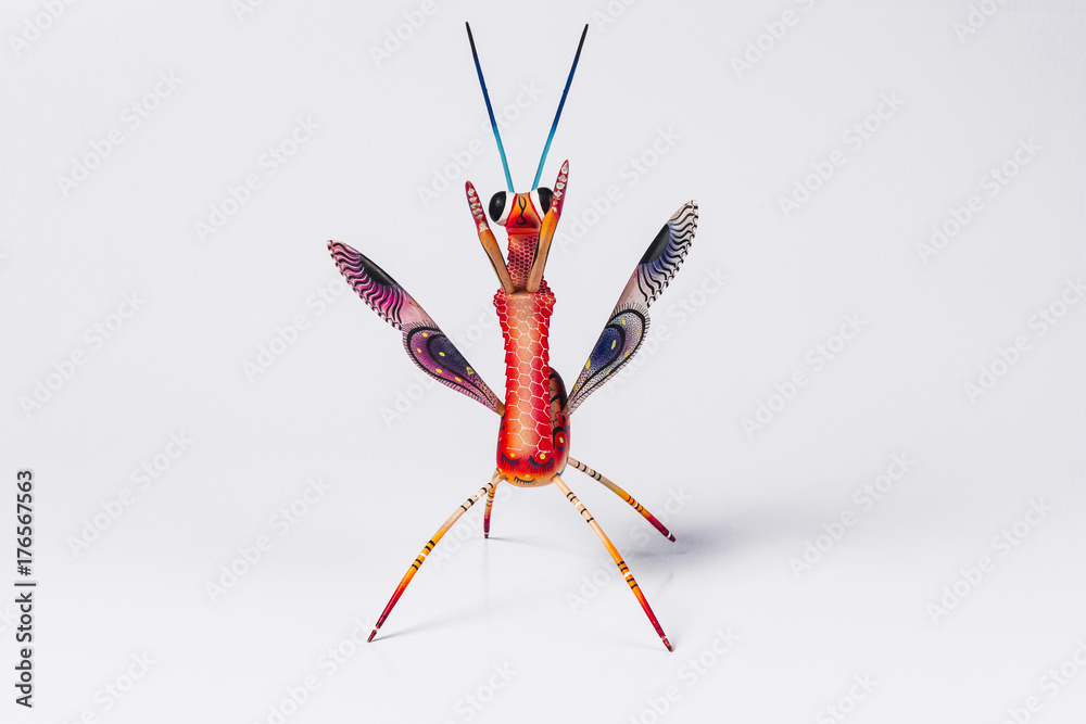 Mexican red mantis alebrije isolated in white background in front view ...
