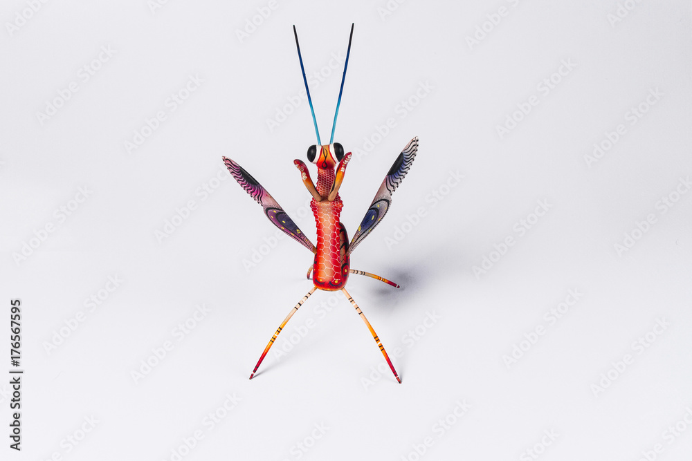 Mexican red mantis alebrije isolated in white background view from ...