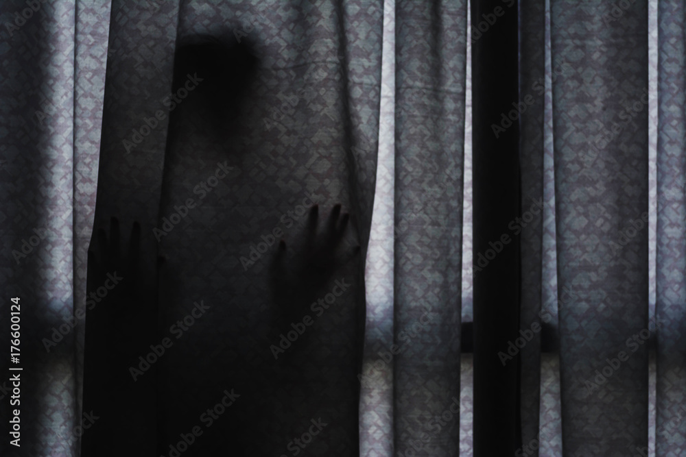 horror scene of woman's shadow standing hiding behind curtain Stock ...