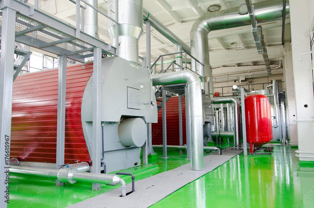 The interior of a modern industrial gas boiler room. Pipelines, water ...