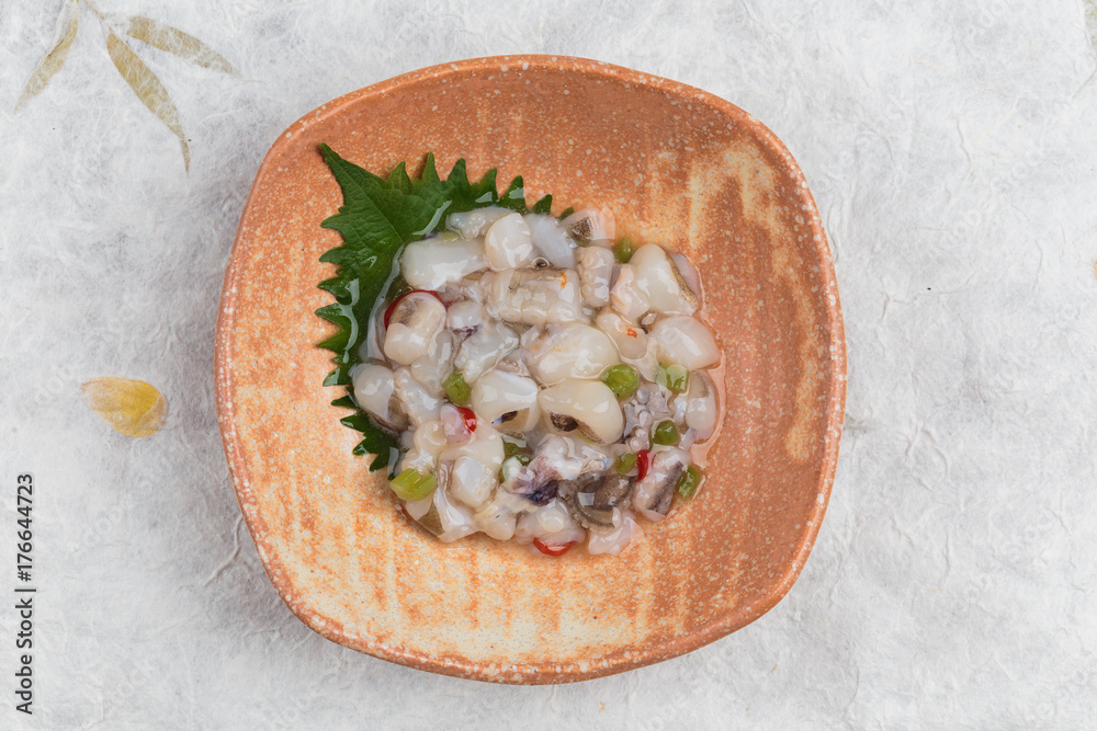 Top view of Tako wasabi is Japanese raw squid mixing with wasabi, shoyu ...