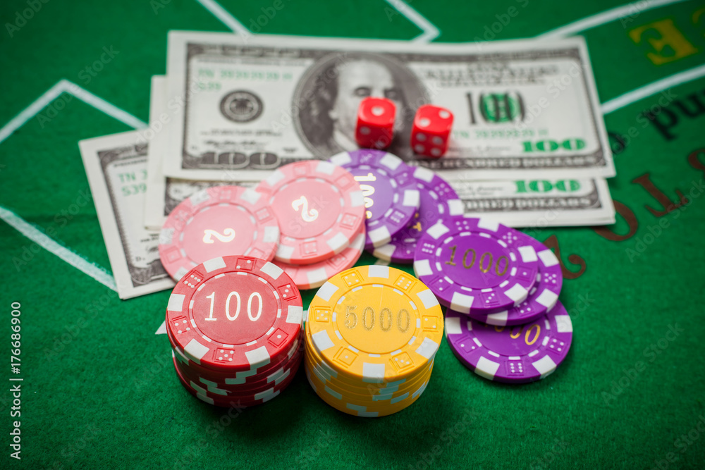 Poker chips and banknotes on table in casino Stock Photo | Adobe Stock