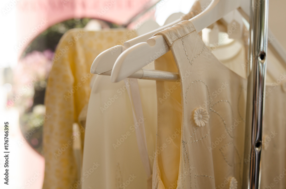 Vintage second hand clothes rail showing fresh creamy vintage clothes ...