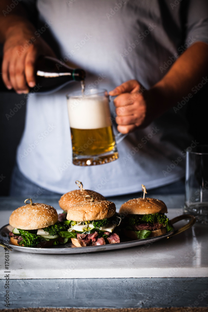 Food Table bar eating hamburger drinking beer glass eating party food ...