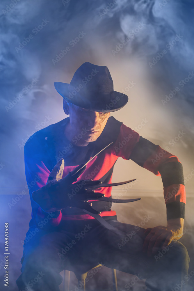 man is a serial killer with a glove sharp knives background for ...