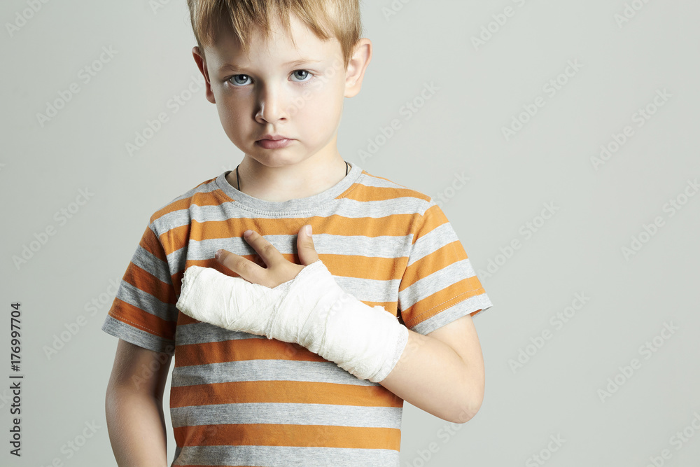 sad little boy.child with a broken arm Stock Photo | Adobe Stock
