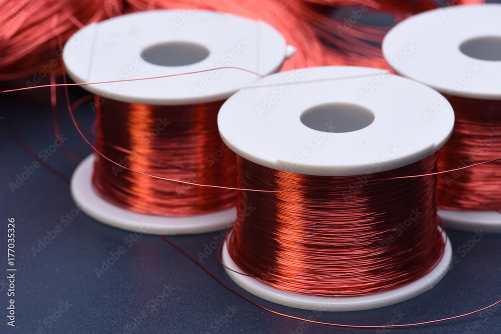 Copper electric coil and wire on metal background Stock Photo | Adobe Stock