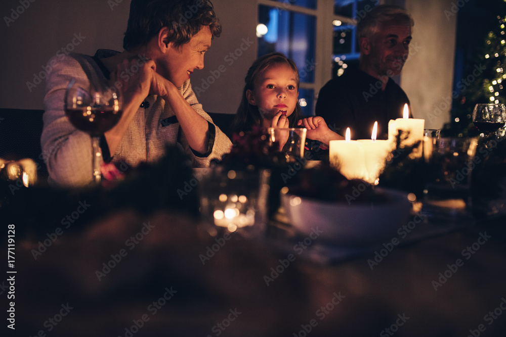 Cute little girl sitting with family for christmas dinner Stock Photo ...