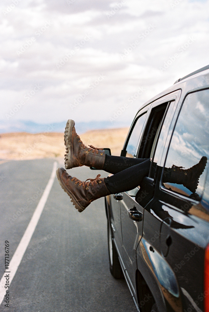 Feet sticking out of car window Stock Photo | Adobe Stock