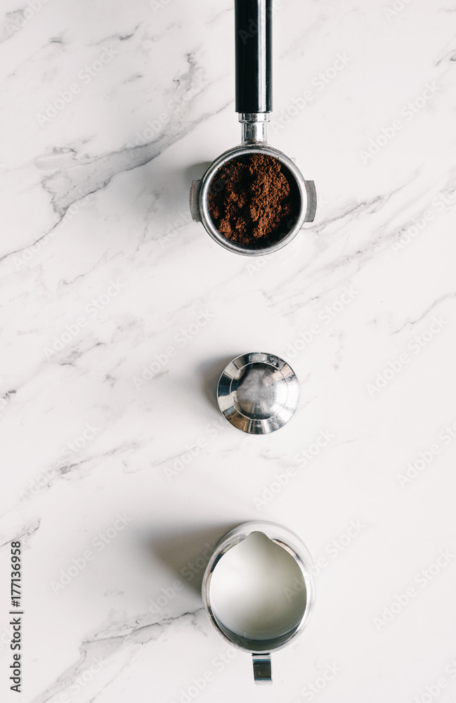 coffee group head with ground coffee, tamper and milk jug Stock Photo ...