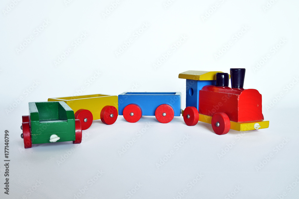 wooden train with locomotive and wagons, assembled with colored blocks ...