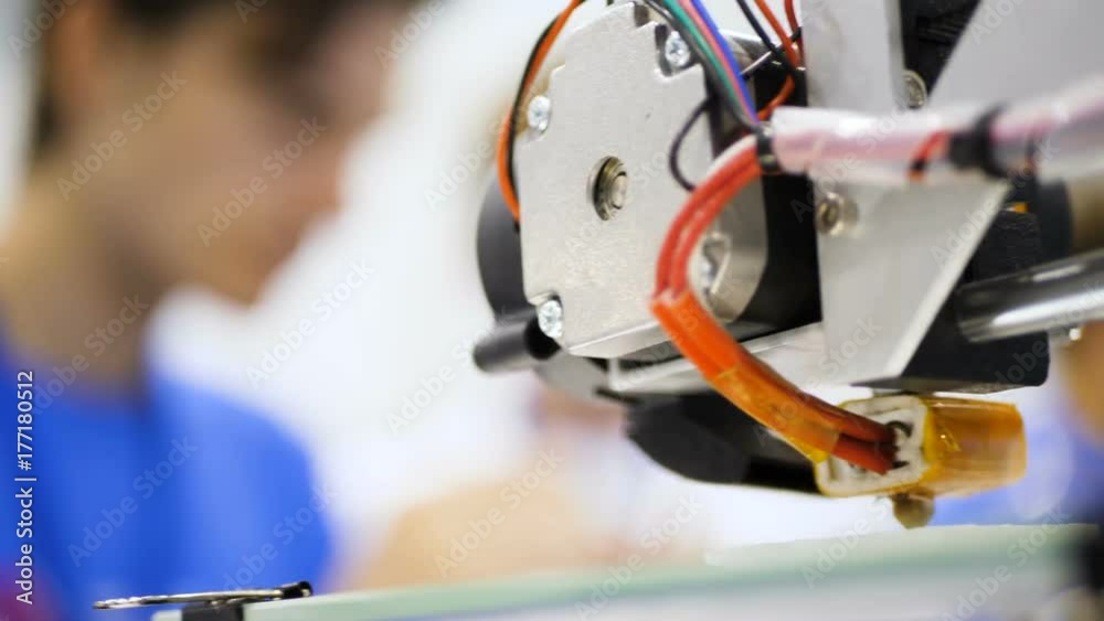 A man makes a layout for 3d printing. A young man makes a 3d model for ...